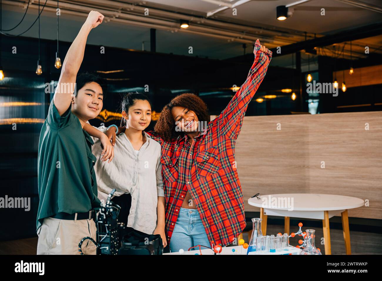 Energetic students filled with excitement raise hands to celebrate ...