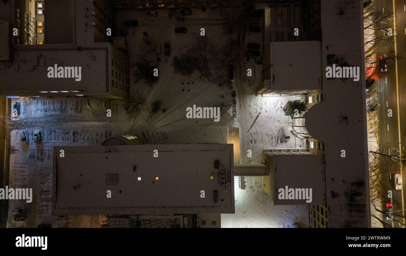 Drone photography of multistory house backyard in a city covered by ...