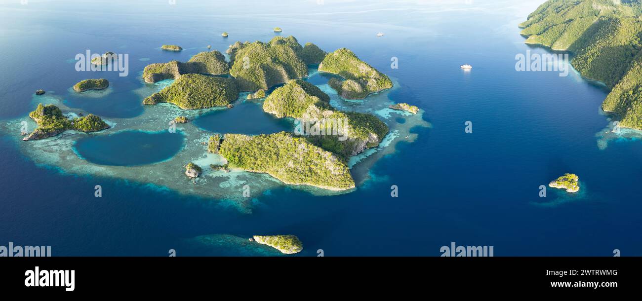 Beautiful limestone islands rise from Raja Ampat's tropical seascape ...