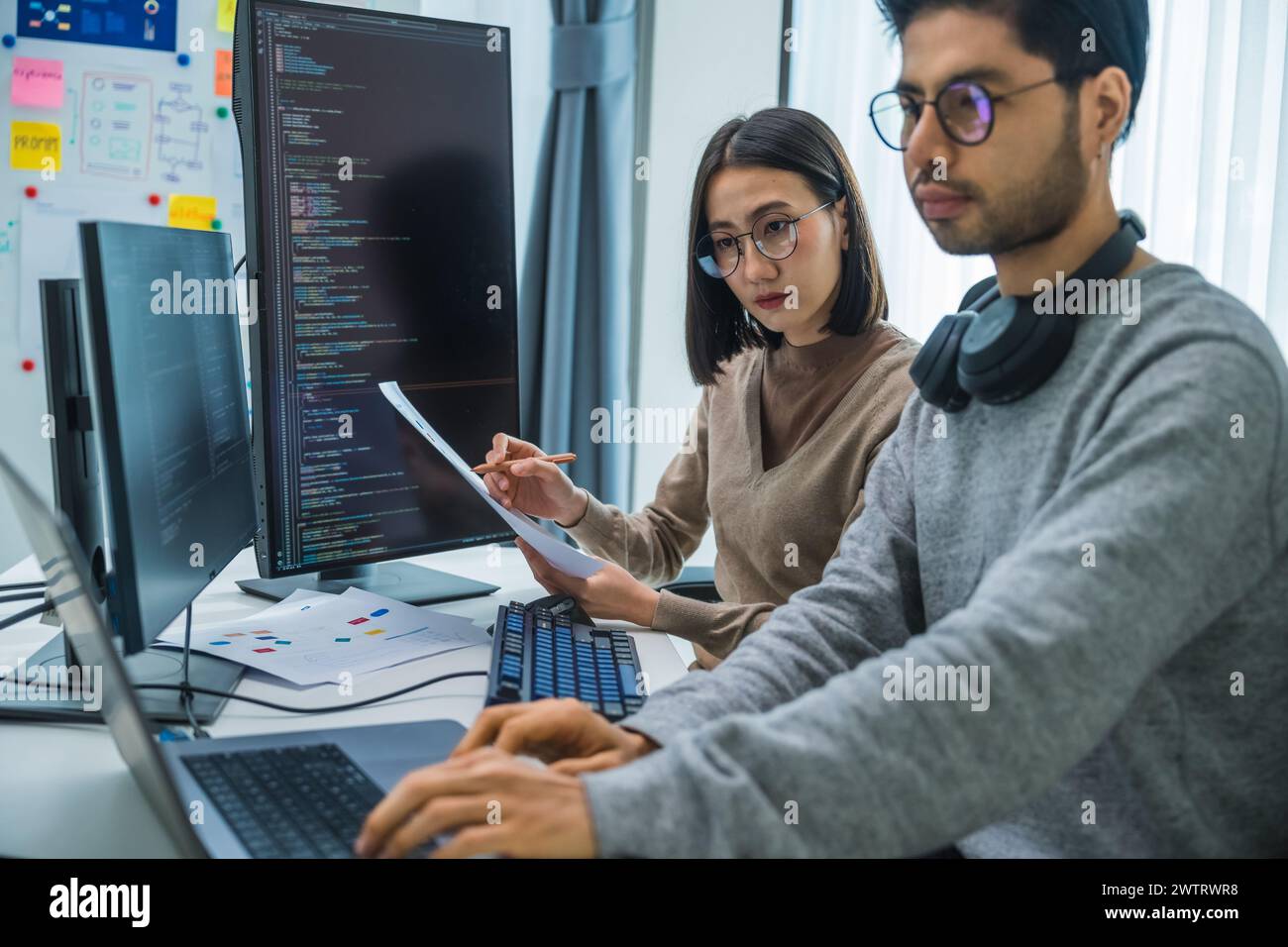 Asian And Indian Developer Team Discussion Feedback Analysis Coding Data With Software Computer