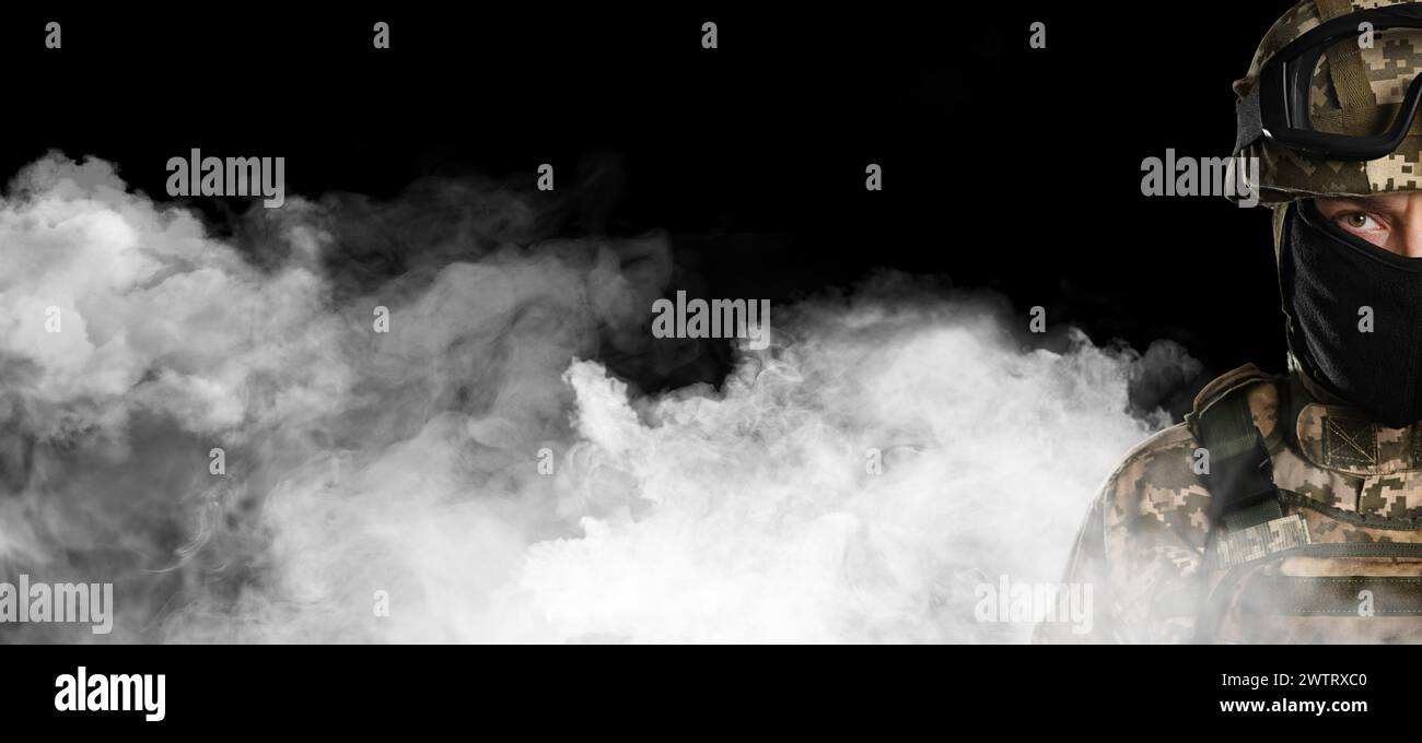 Armed soldier in smoke on black background, space for text. Banner ...