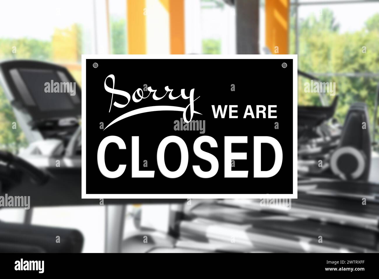 Sorry we are closed sign against blurred background Stock Photo - Alamy