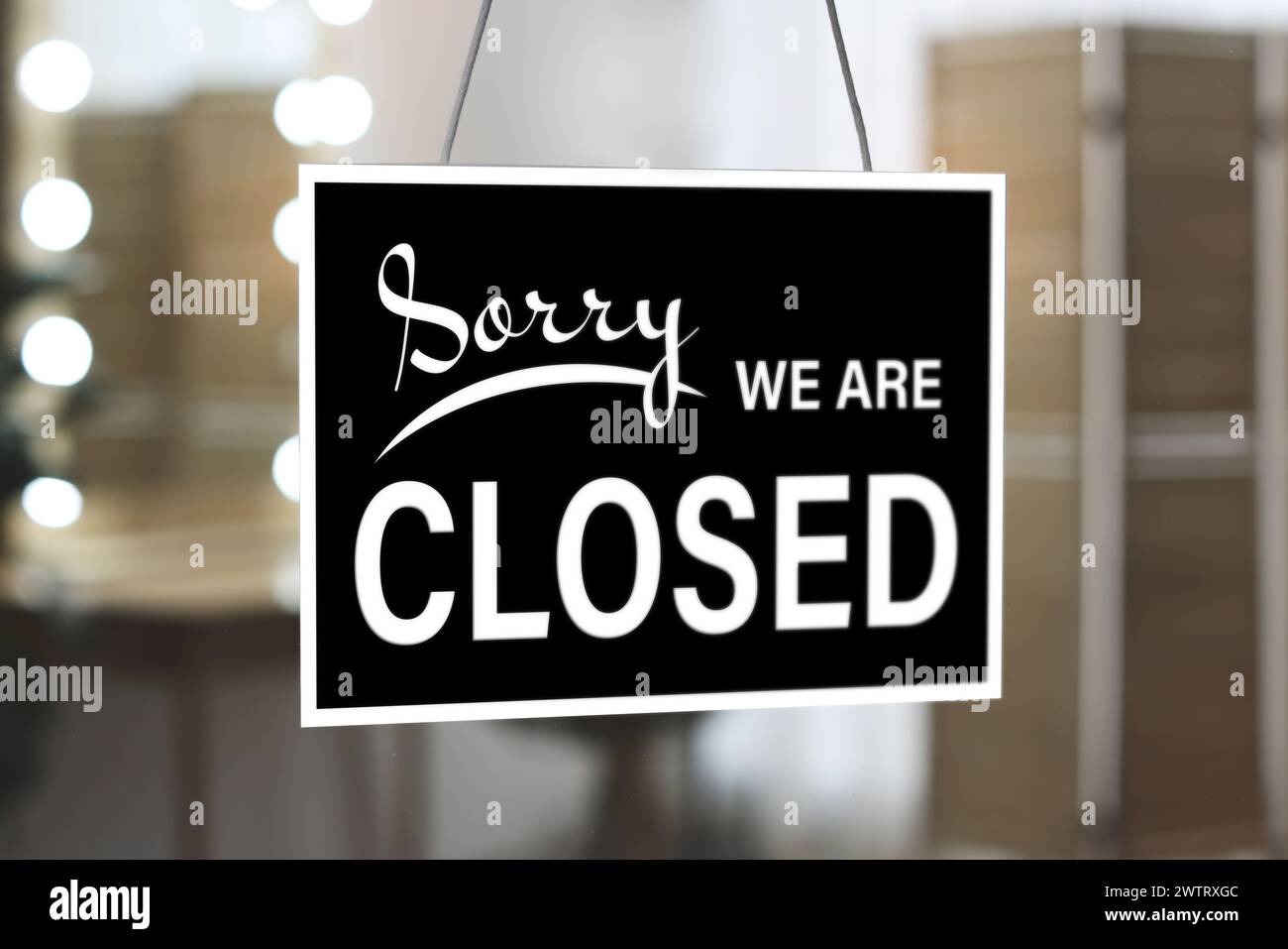 Sorry we are closed sign against blurred background Stock Photo - Alamy