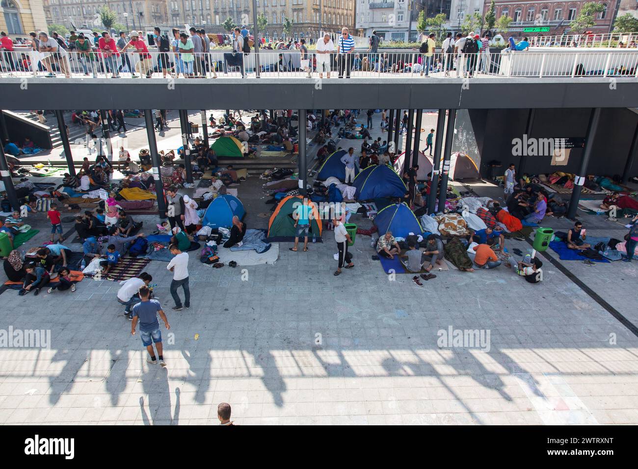 Syrian and other Arab Refugees crowd wait for their onward journey to ...