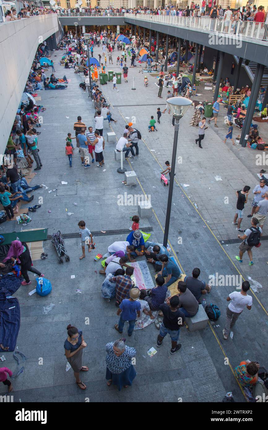 Syrian and other Arab Refugees crowd wait for their onward journey to ...