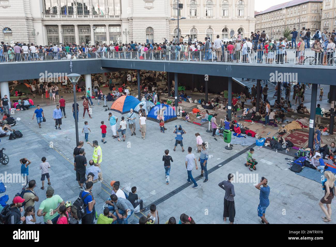 Syrian and other Arab Refugees crowd wait for their onward journey to ...