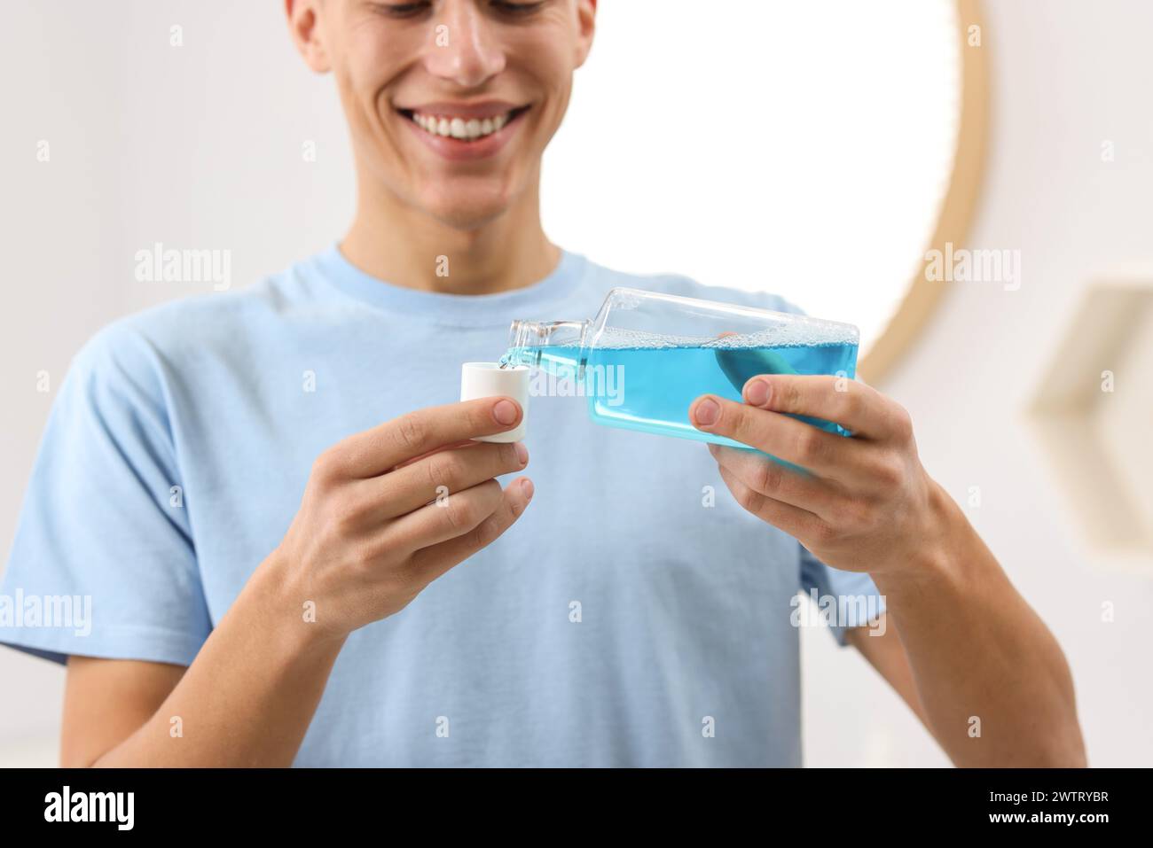 Young man using mouthwash hi-res stock photography and images - Alamy