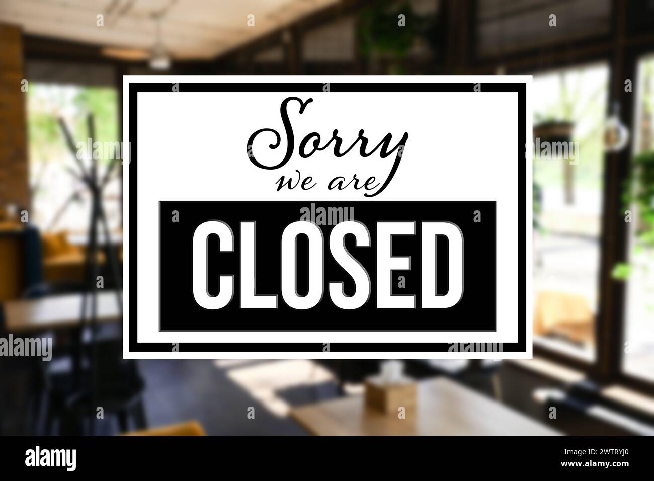 Sorry we are closed sign against blurred background Stock Photo - Alamy