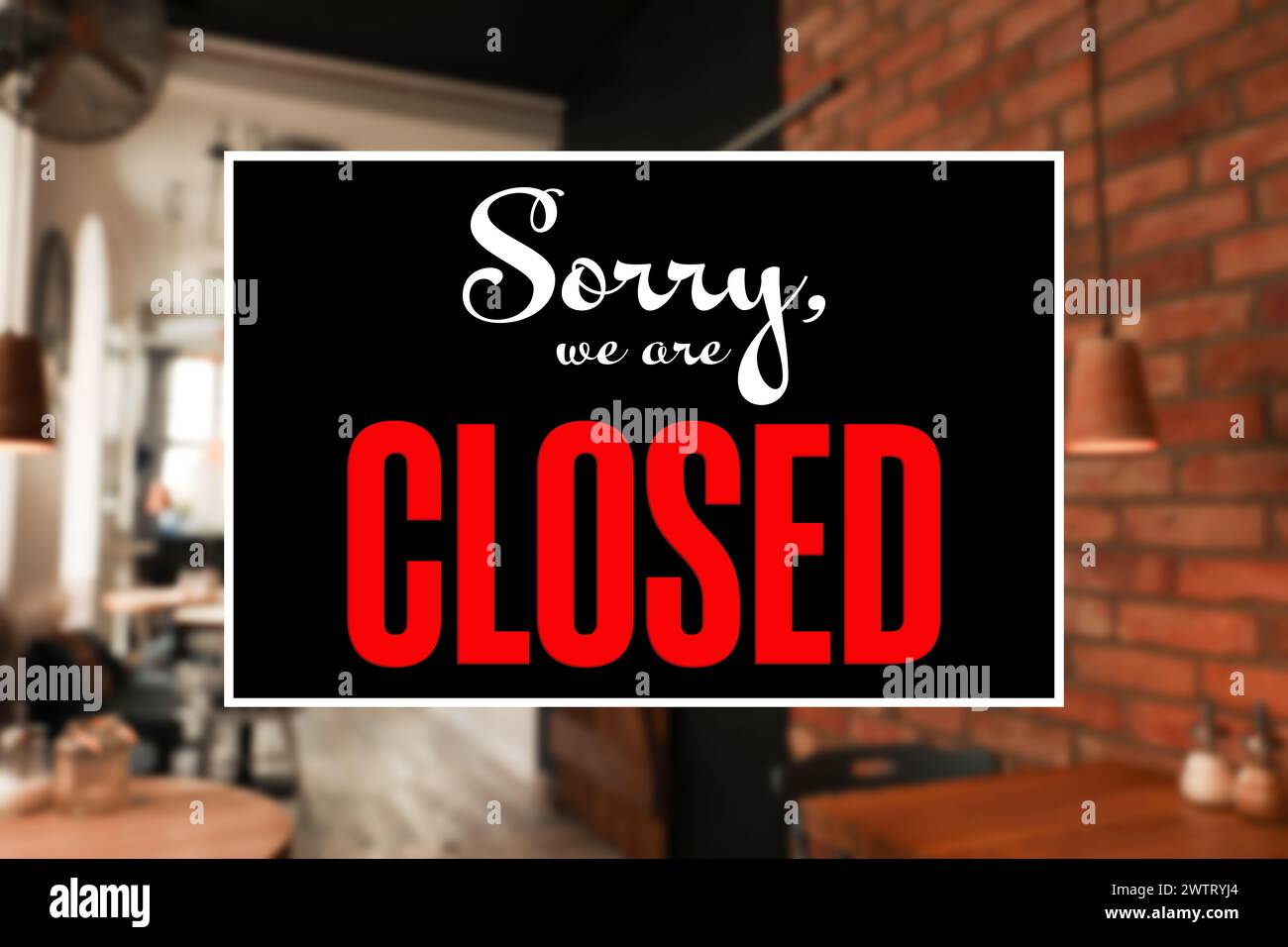 Sorry we are closed sign against blurred background Stock Photo - Alamy