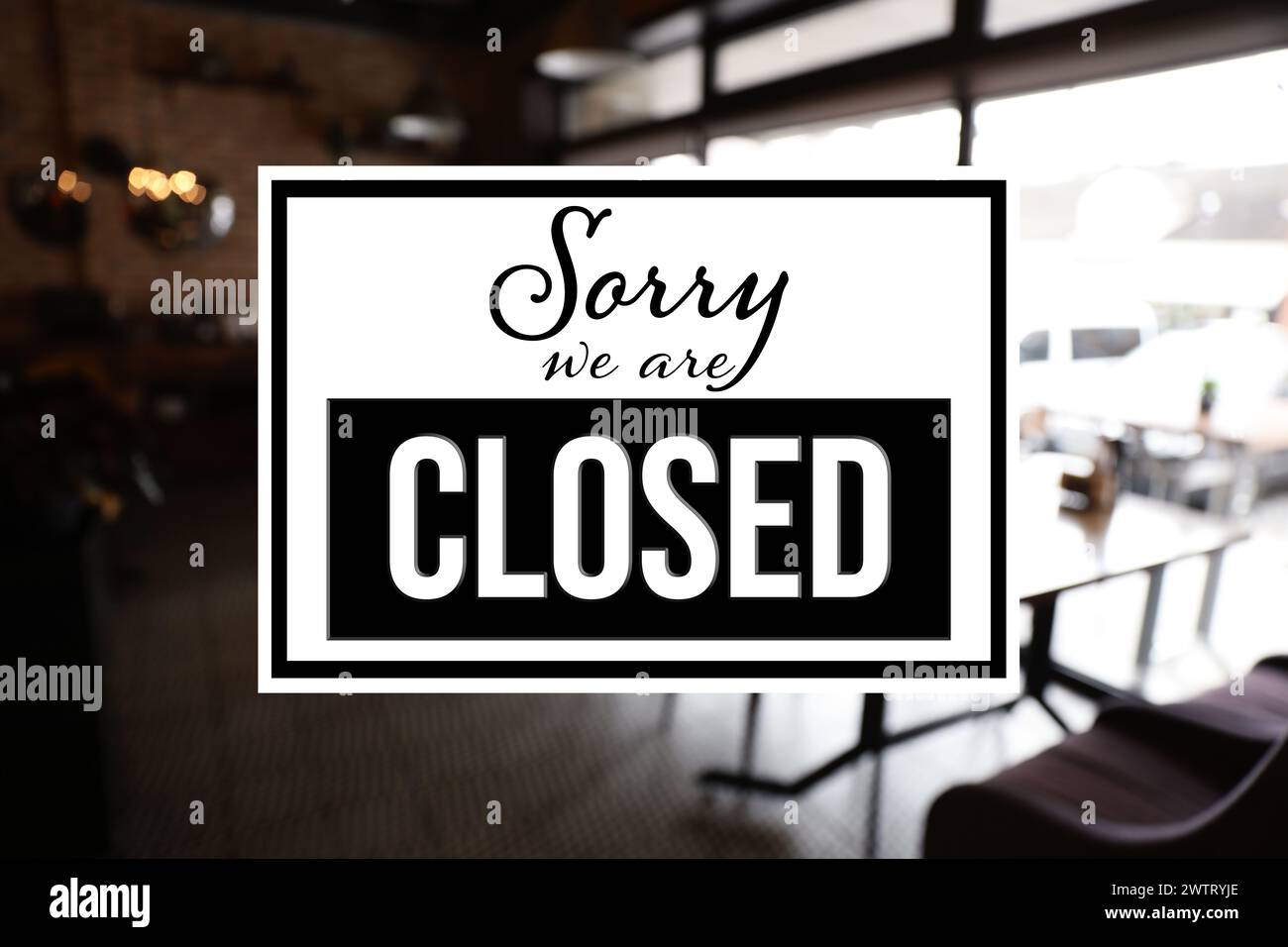 Sorry we are closed sign against blurred background Stock Photo - Alamy