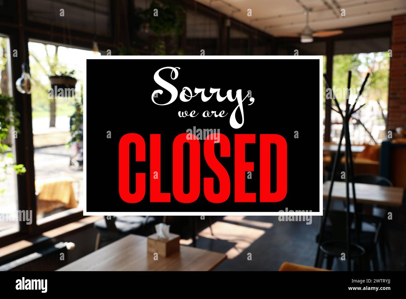 Sorry we are closed sign against blurred background Stock Photo - Alamy
