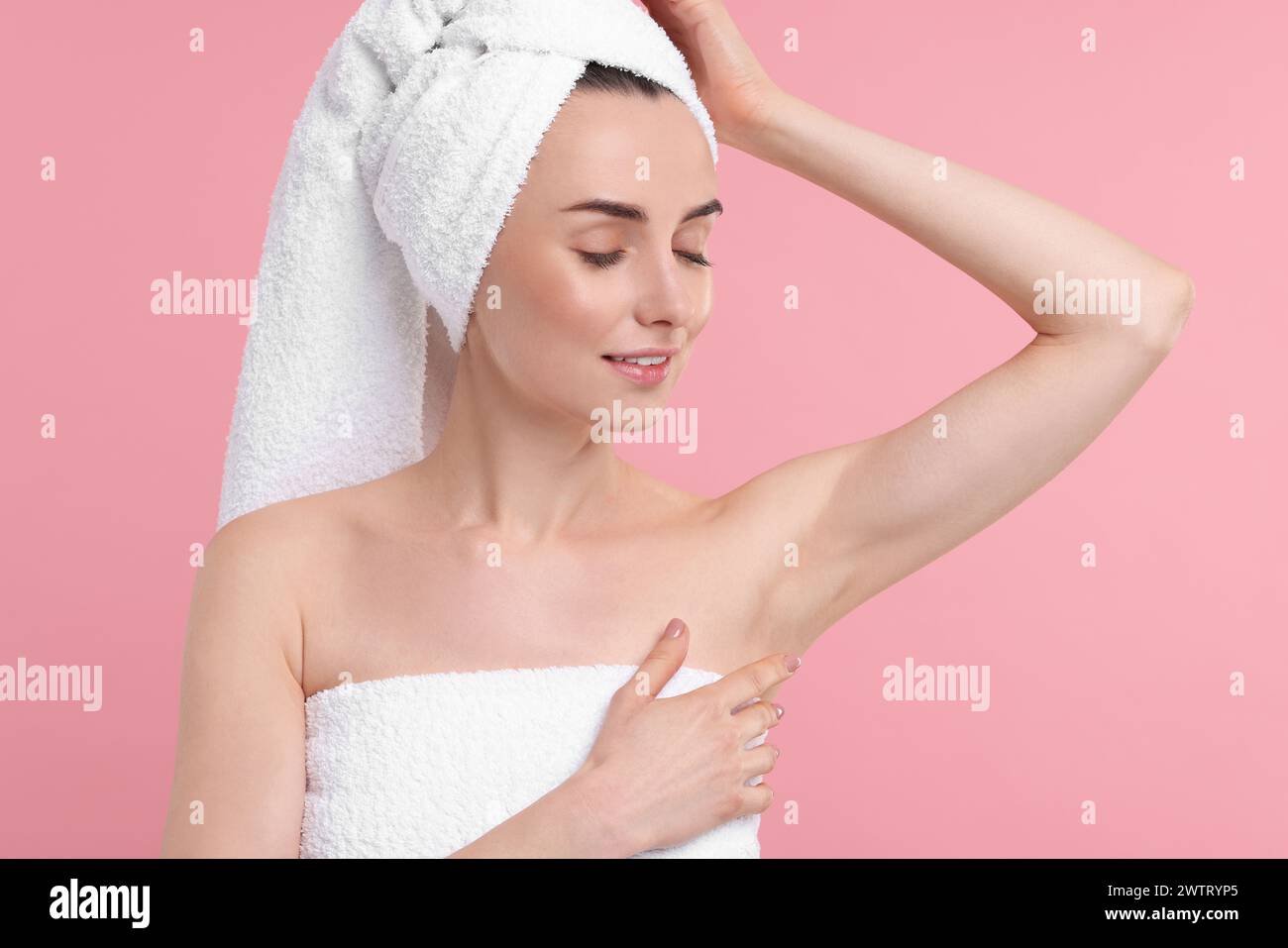 Beautiful woman showing armpit with smooth clean skin on pink ...