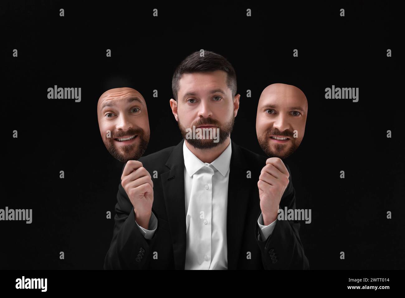 Man holding masks with his face showing different emotions on black ...