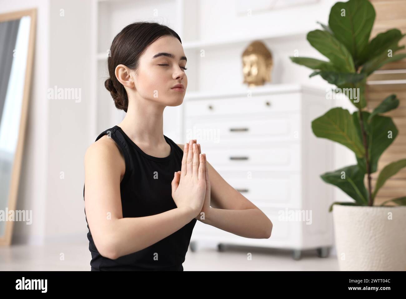 Caucasian teen girl meditating hi-res stock photography and images - Alamy