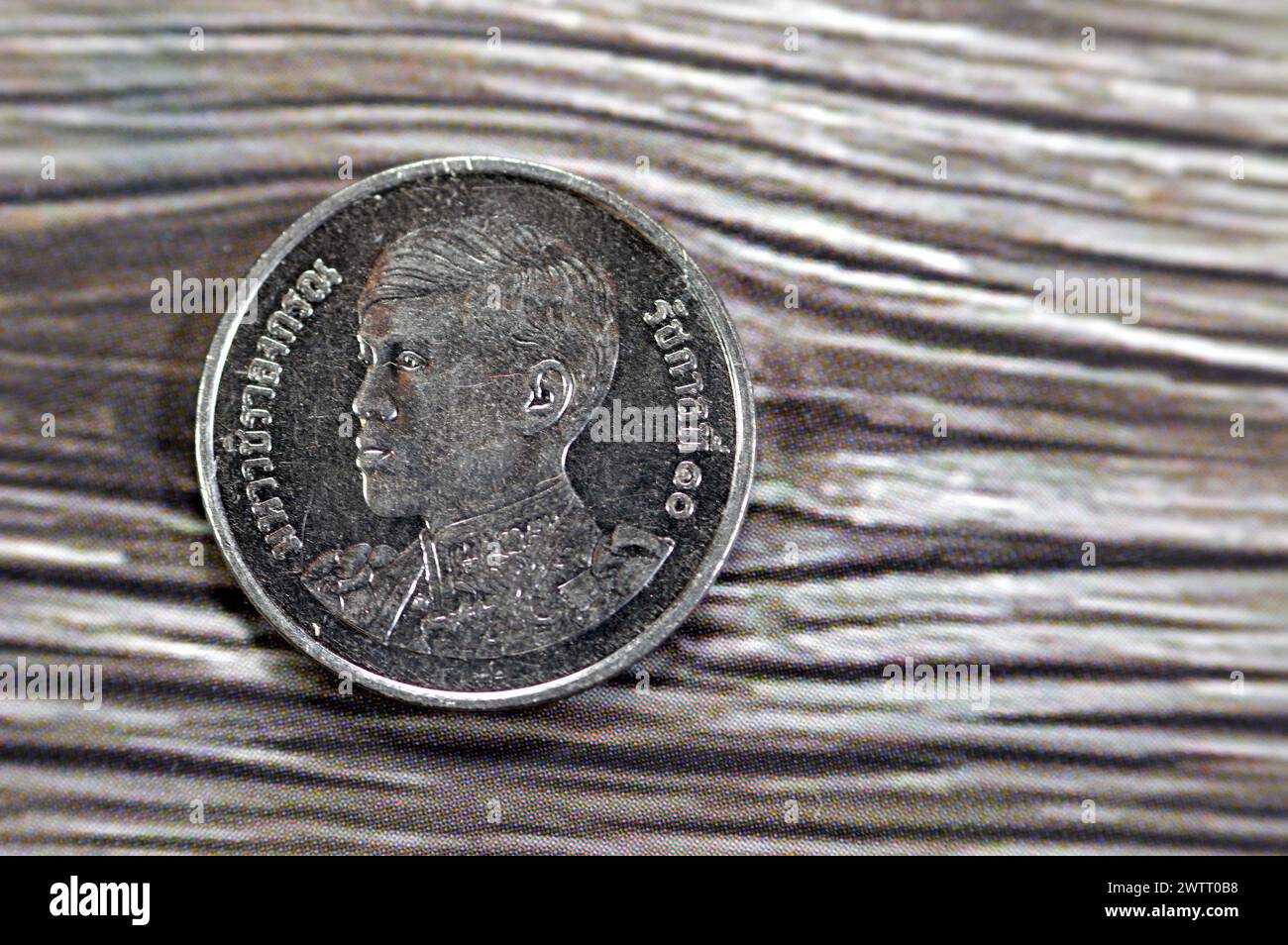 Obverse side of 1 one Baht Thai coin features Bust facing left of Maha ...