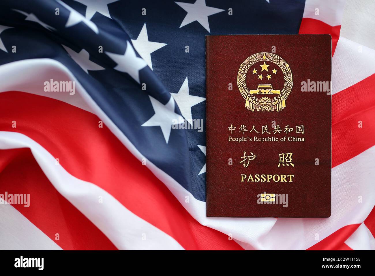 Red passport of People Republic of China on United States flag. PRC ...