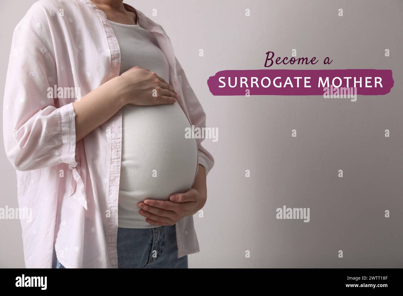 Surrogate mother. Pregnant woman touching her belly on light background ...
