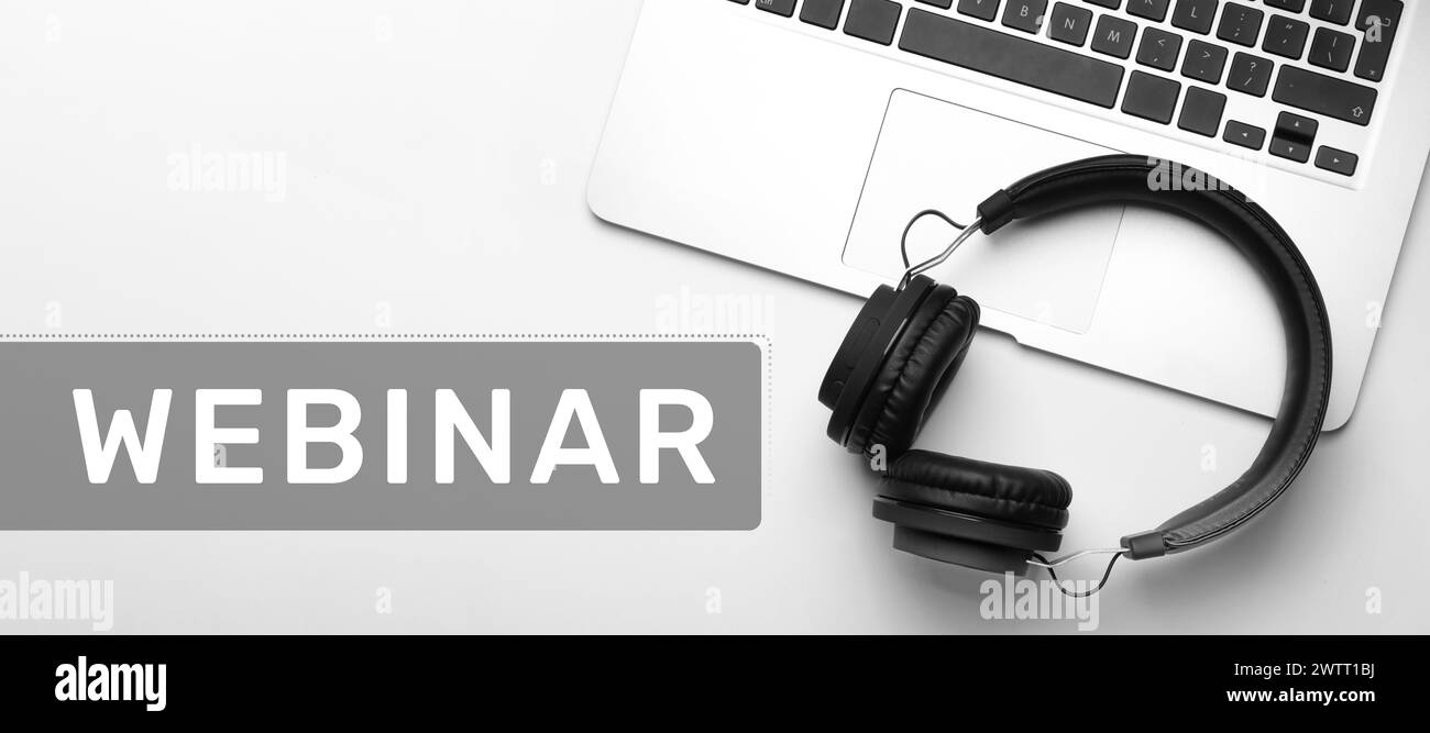 Webinar. Headphones and laptop on white table, top view. Banner design ...