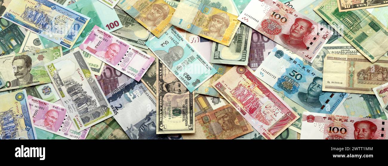 Many banknotes of different currency. Background of big amount of ...