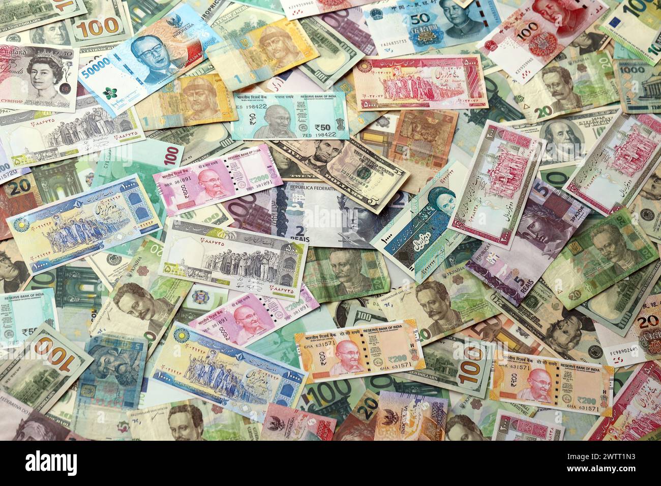 Many banknotes of different currency. Background of big amount of ...