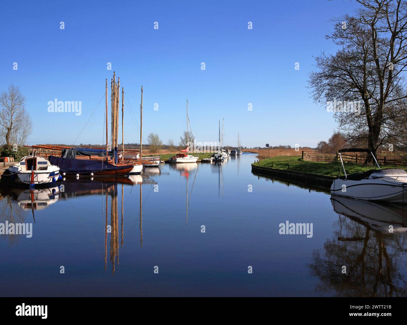 A view of the Staithe and Boat Dike with moored boats in the Bure ...