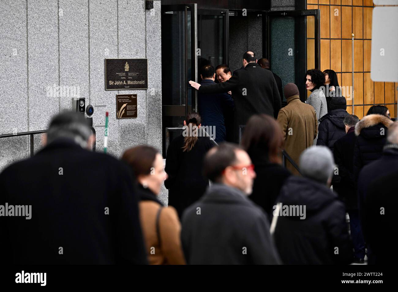 Dignitaries make their way into the Sir John A. Macdonald Building ...