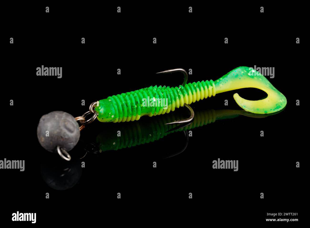 Soft fishing bait, green plastic grub, with double hook and lead sinker ...