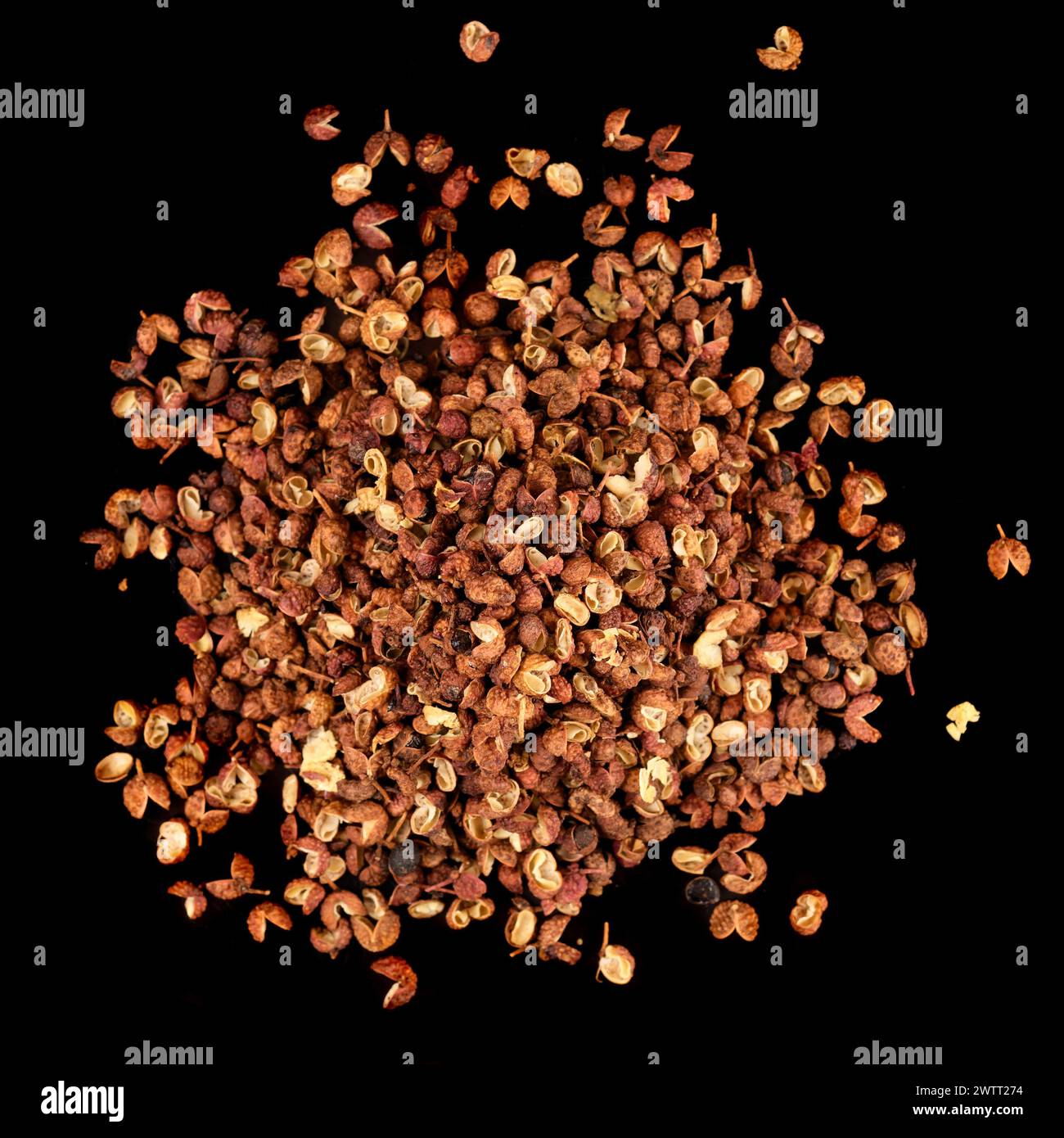 Pile of Sichuan Chinese pepper isolated on black background, shot from ...