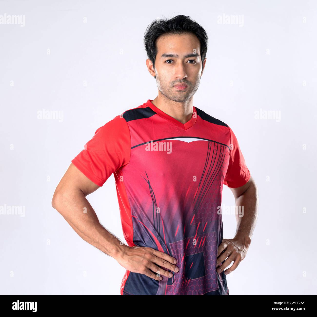 Male footballer wearing athletic uniform and shoes, standing still ...