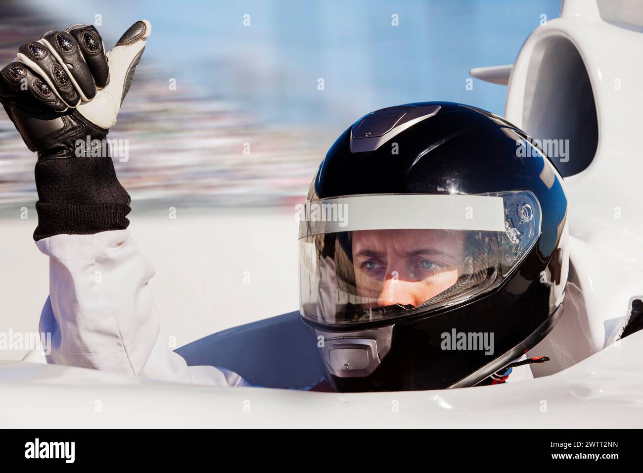 Race car driver focused and ready behind the wheel Stock Photo - Alamy