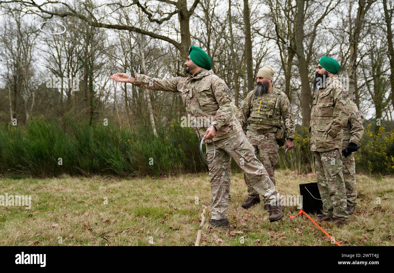 Sikh soldiers of the British Army compete in a game of quoits as he ...