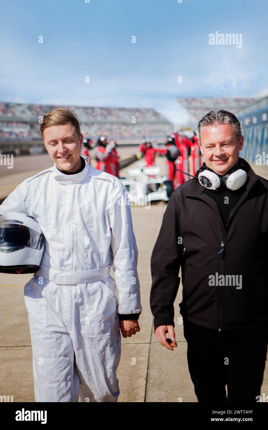 Two people ready for a race day experience, with one dressed in a ...