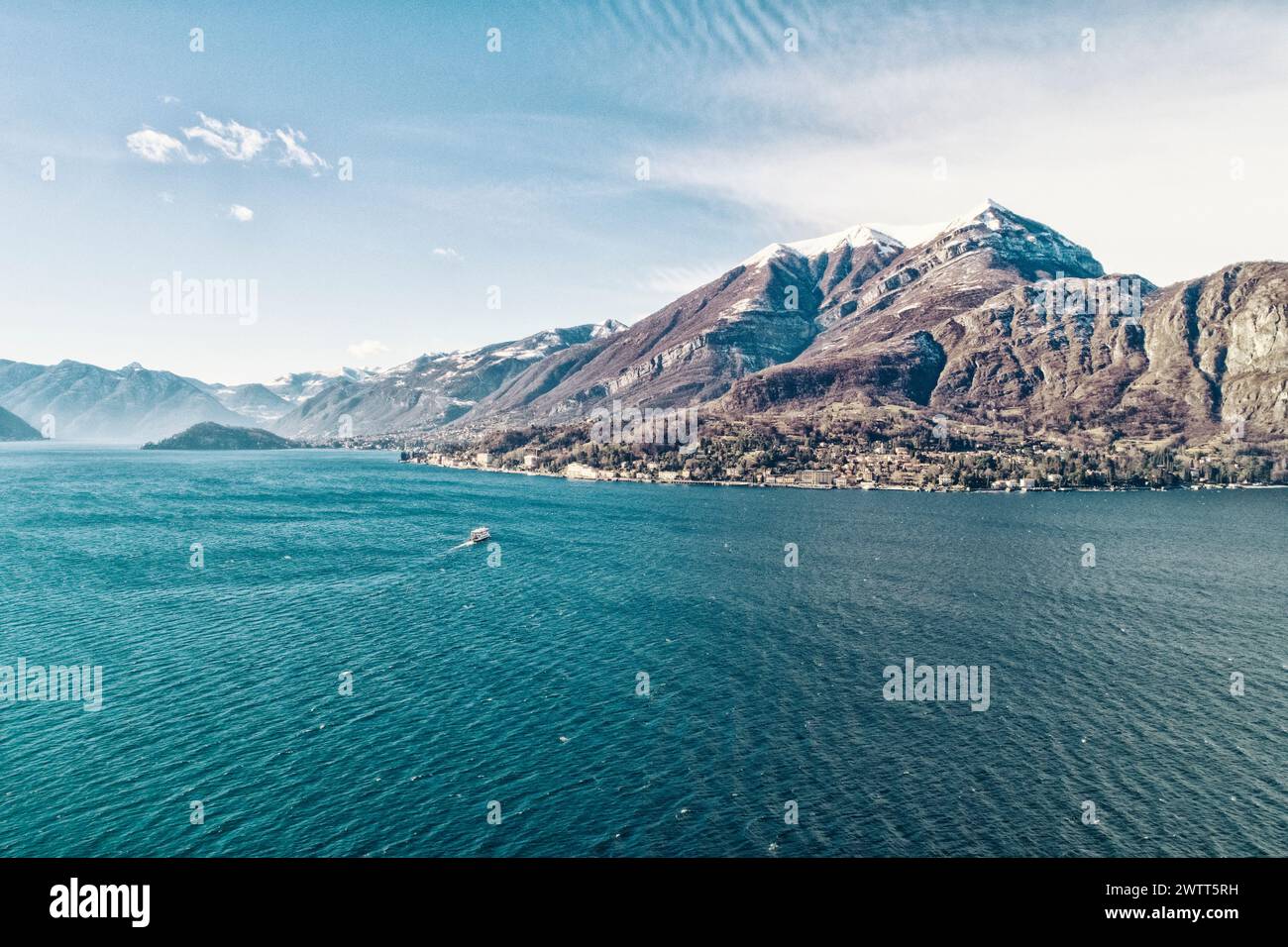 Aerial view of lake Como with the Alps and villages around the lake ...
