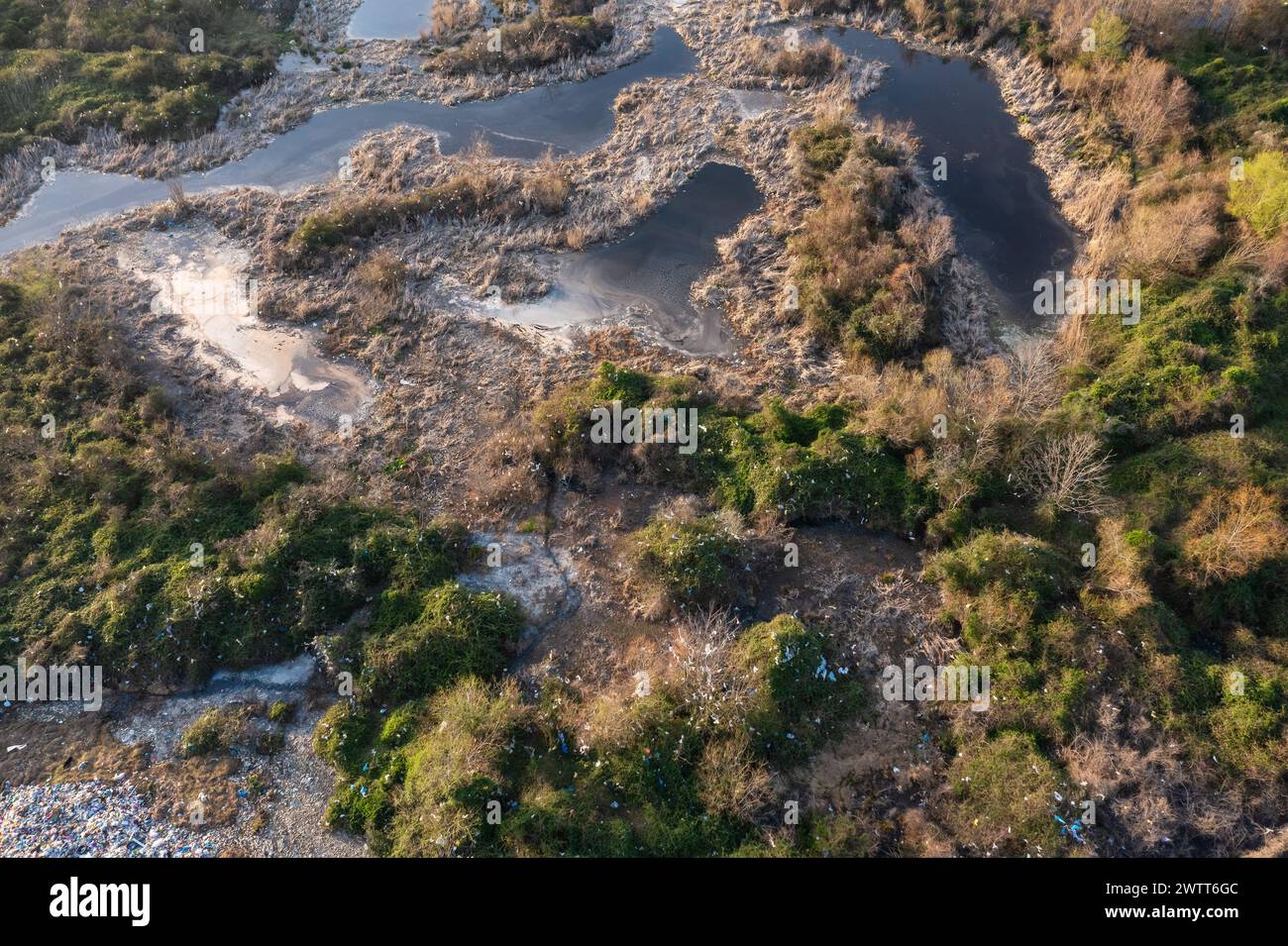 Aerial view of poisoned water of lake near trash dump. Biohazard for ...