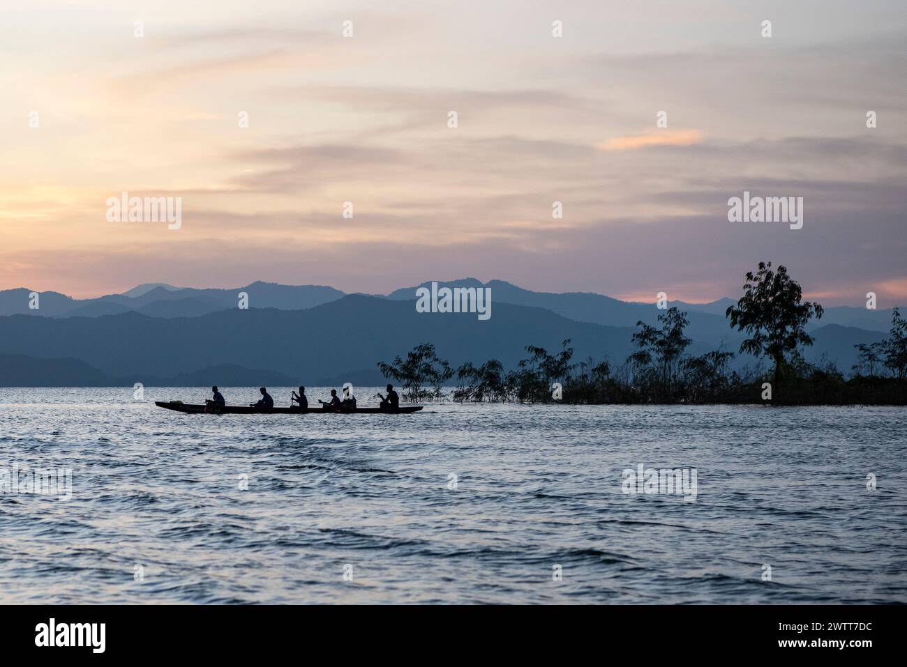 a Longboat rowing Team at training on the Lake Kaeng Krachan Dam in the ...
