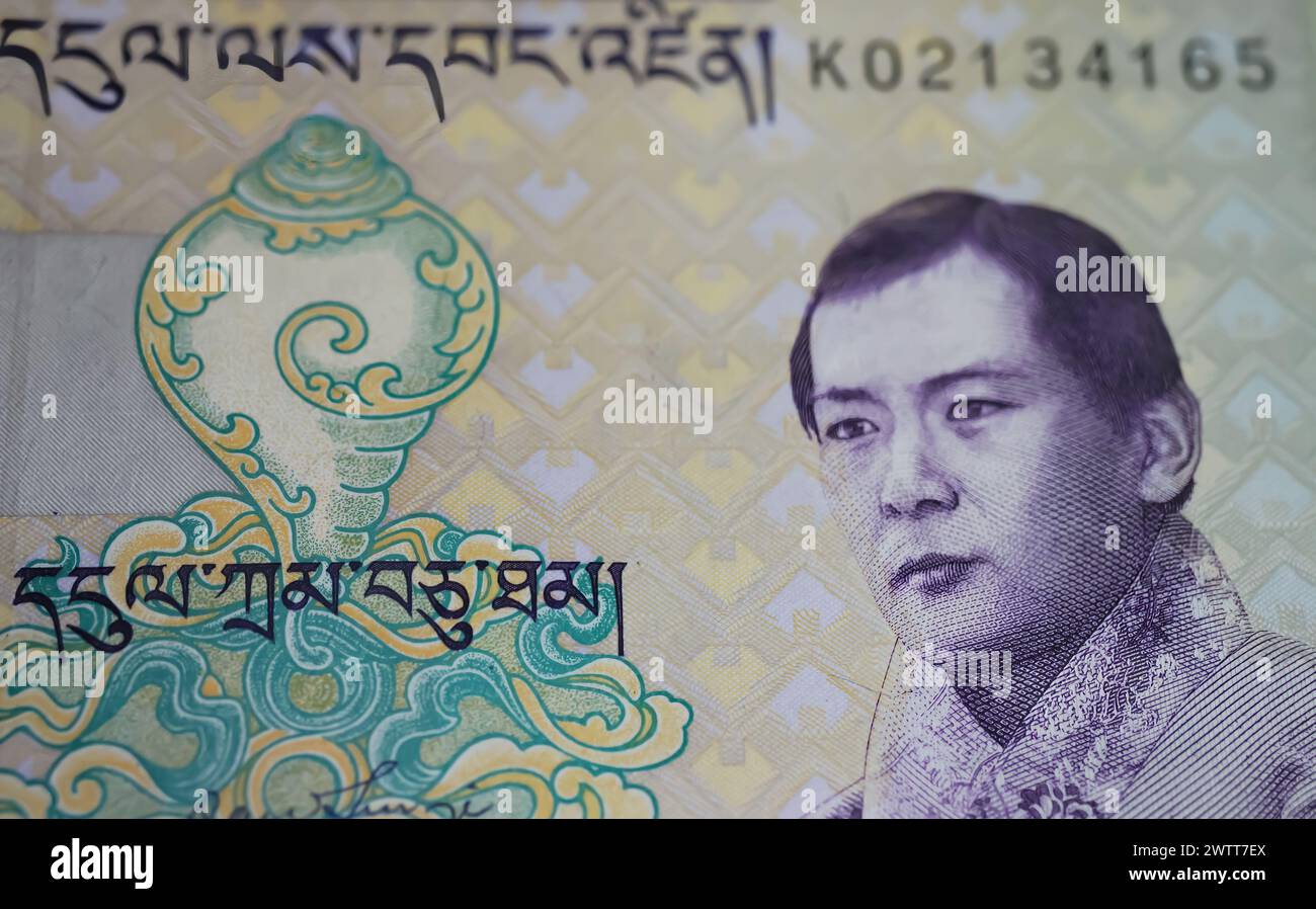 Closeup portrait of King Jigme Singye Wangchuck on old Ngultrum Bhutan ...