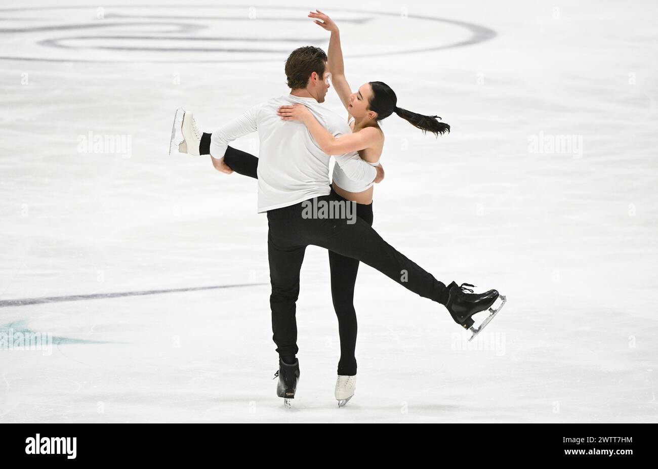 Lia Pereira and Trennt Michaud, from Canada, perform their pairs ...