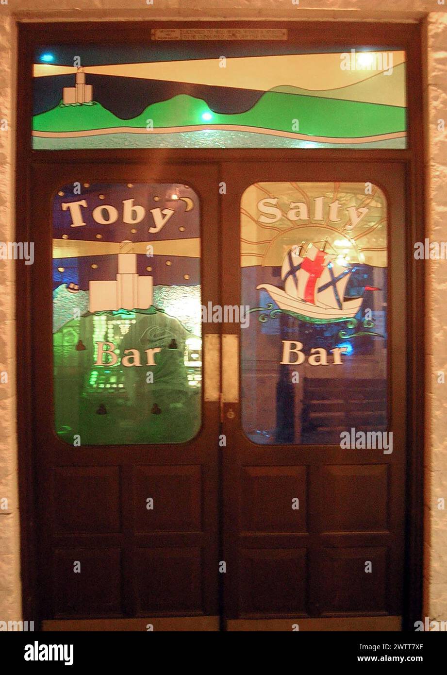 The entrance door to the Toby and Salty Bars by Mumbles Pier which made ...
