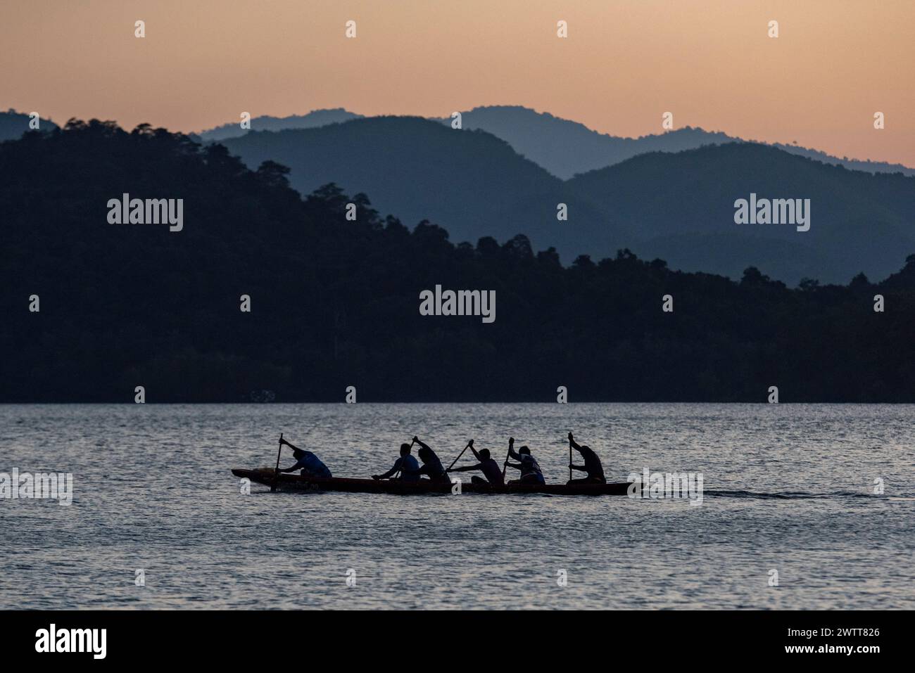 a Longboat rowing Team at training on the Lake Kaeng Krachan Dam in the ...