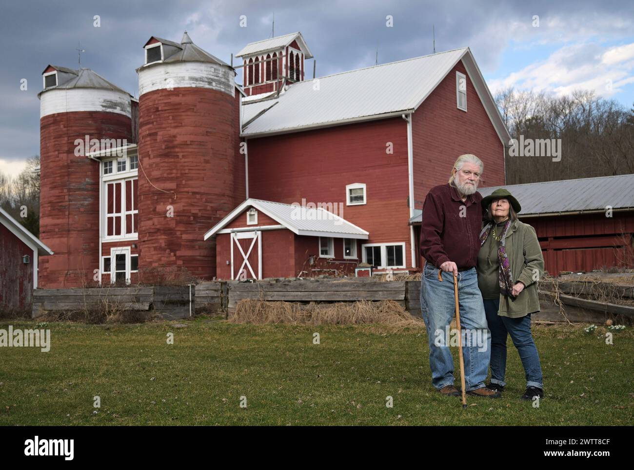 Joan and Harold Koster pose for a photo in front of a historic barn on ...