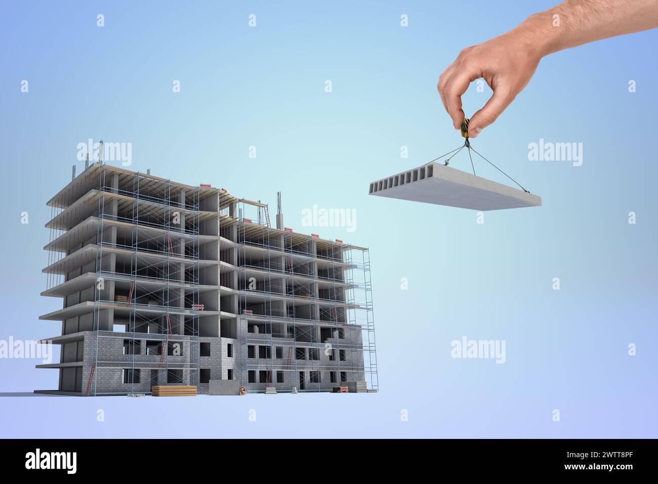 Hand placing the last piece on a construction site Stock Photo - Alamy