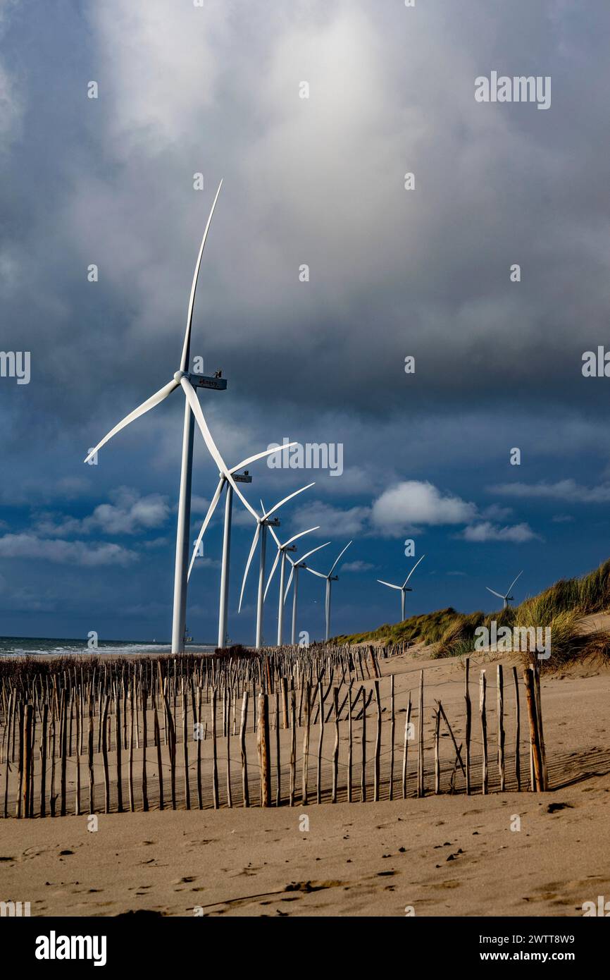 White wind turbines against a blue sky hi-res stock photography and ...