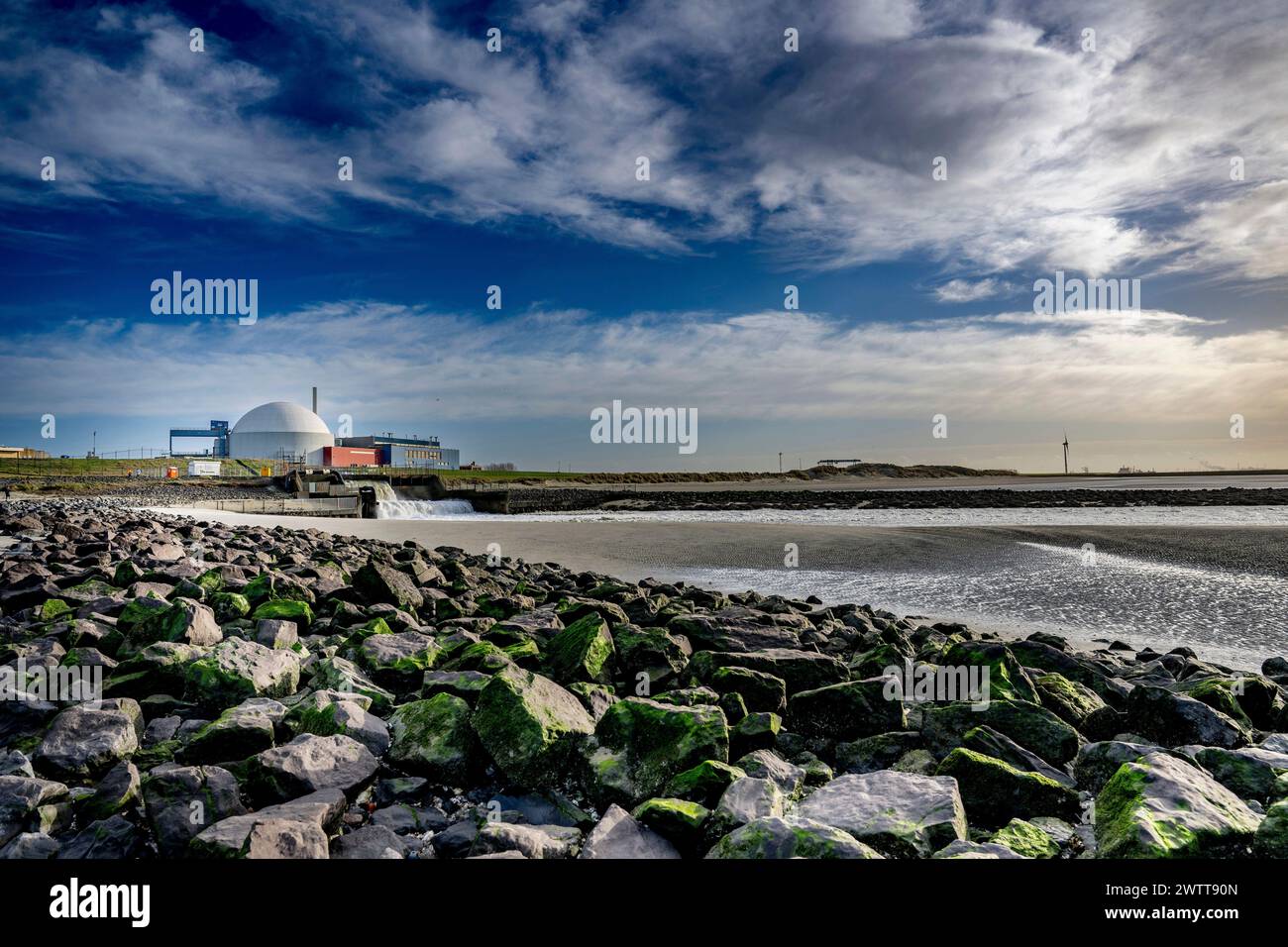 A majestic coastal nuclear power plant under a dynamic cloudy sky Stock ...