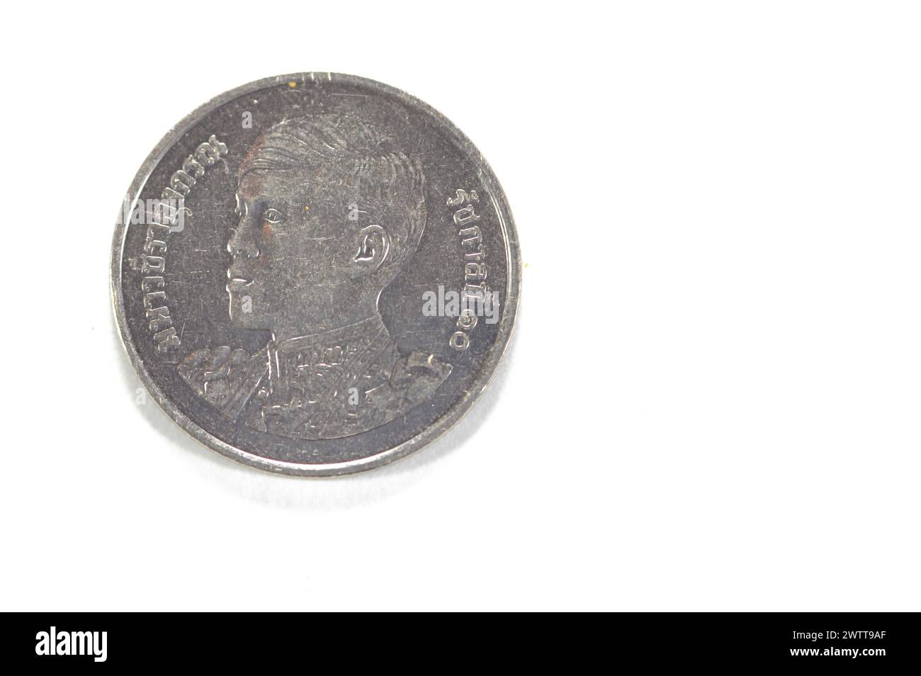 Obverse side of 1 one Baht Thai coin features Bust facing left of Maha ...