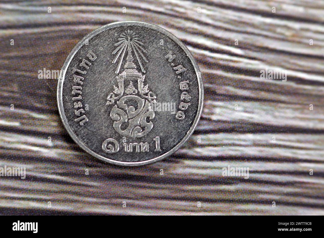 Reverse side of 1 one Baht Thai coin features Crowned monogram, 1 Baht ...