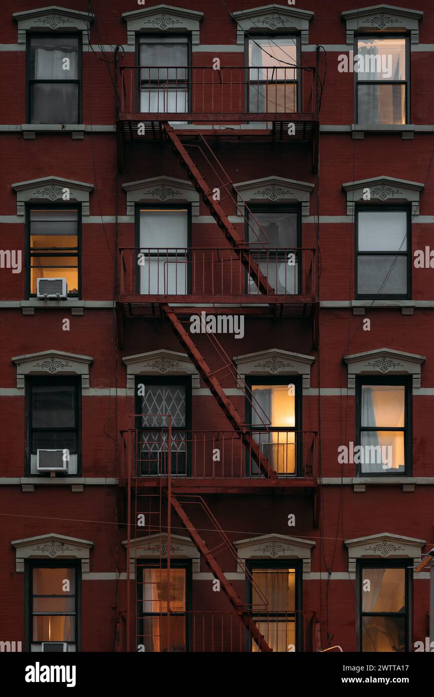 Charming New York Architecture with Fire Escapes and Lit Windows Stock ...