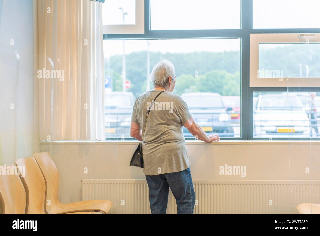 Waiting by the window hi-res stock photography and images - Alamy
