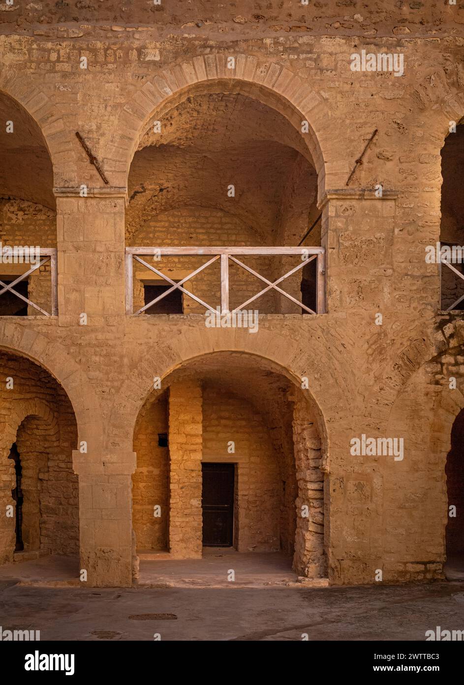 A galleried walkway and arches inside the entrance courtyard at the 8th ...