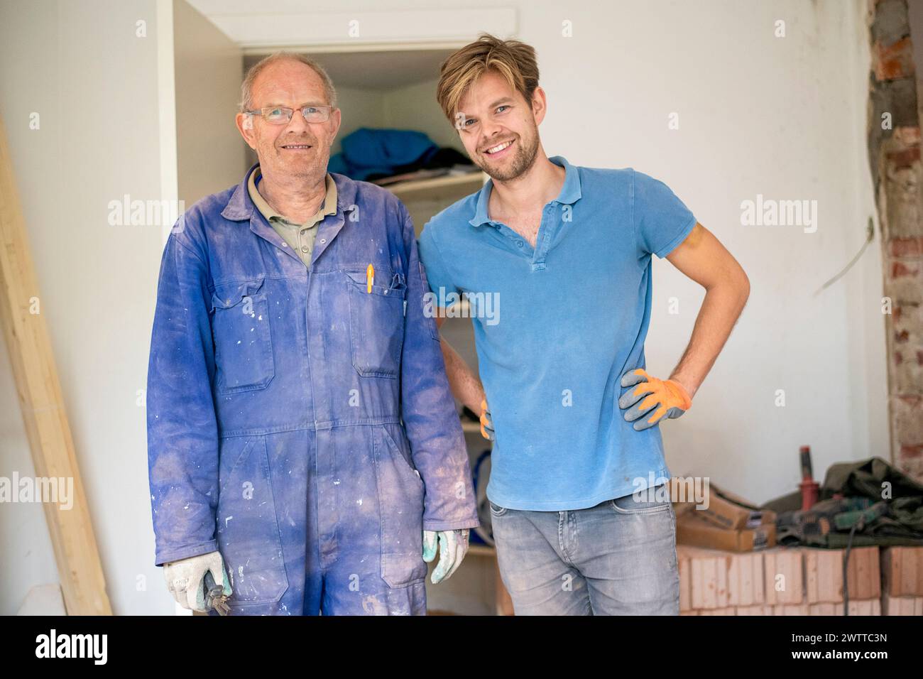 A moment of camaraderie between two generations at a renovation site ...