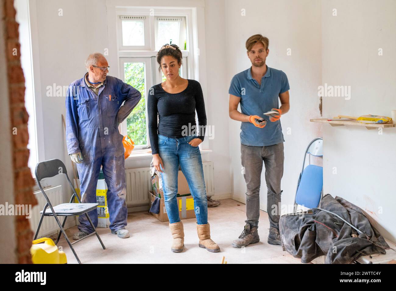 A team taking a break during a home renovation project Stock Photo - Alamy